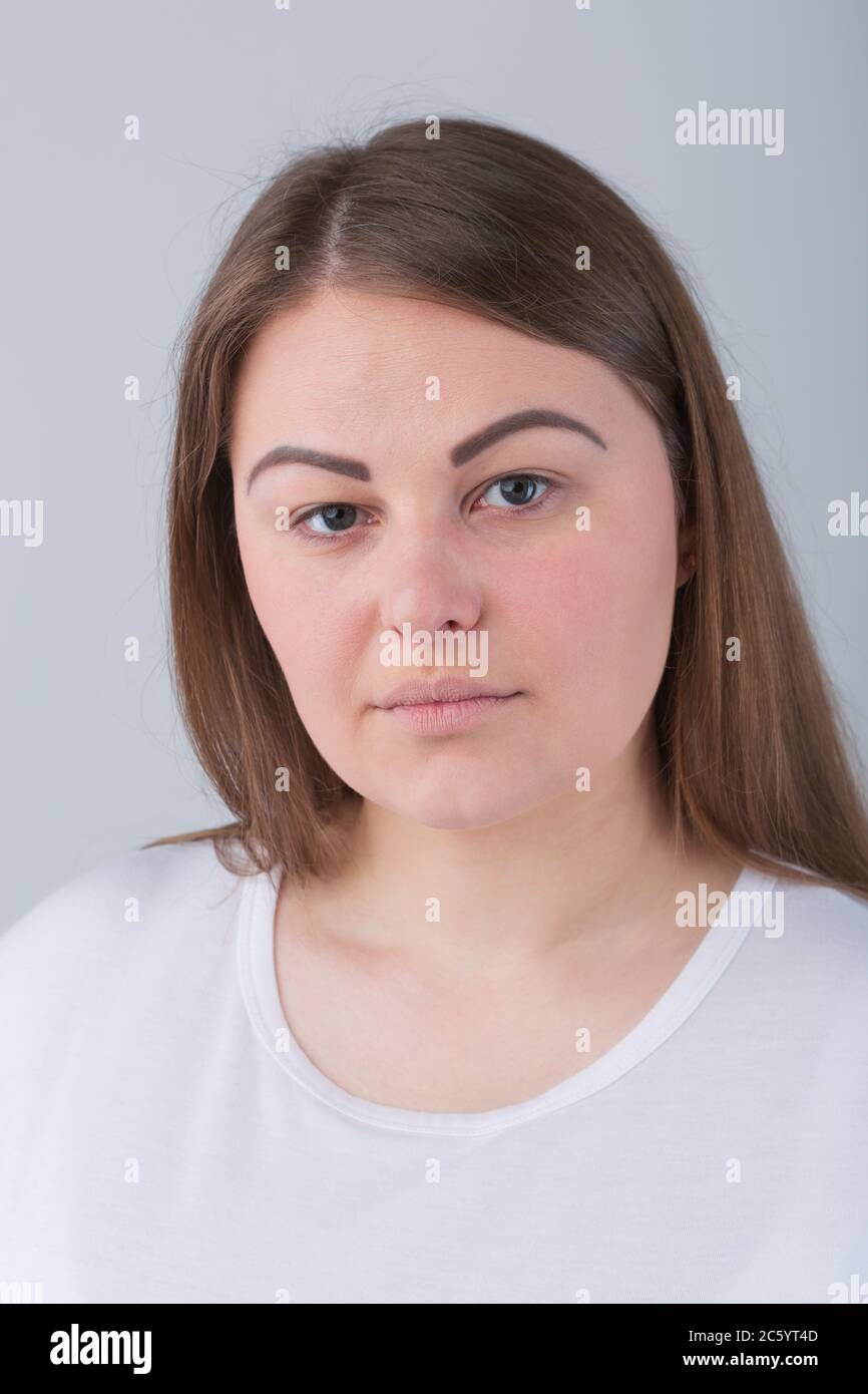 Beautiful plus size girl portrait in studio.Attractive Caucasian female ...