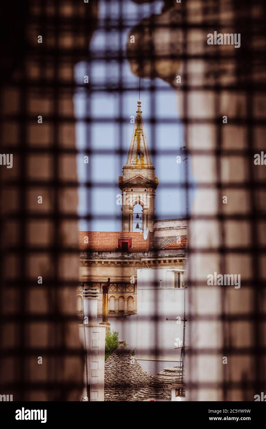Spectacular view on the ancient cathedral through the window grill ...