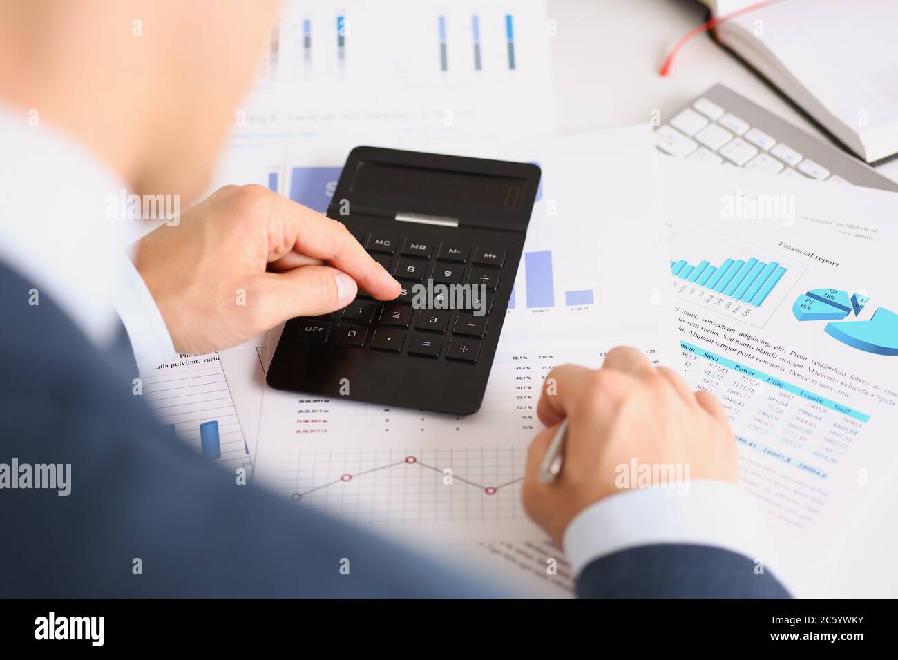 Black calculator and financial statistics on infographics Stock Photo ...