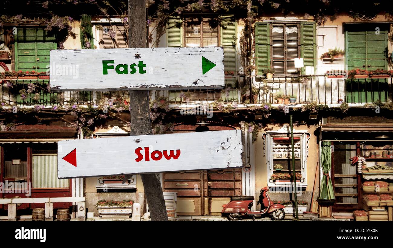 Street Sign the Direction Way to Fast versus Slow Stock Photo - Alamy
