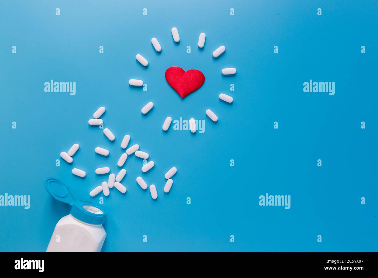 Pills,tablets and red heart. Cardiology and medicine, pharmacy concept ...