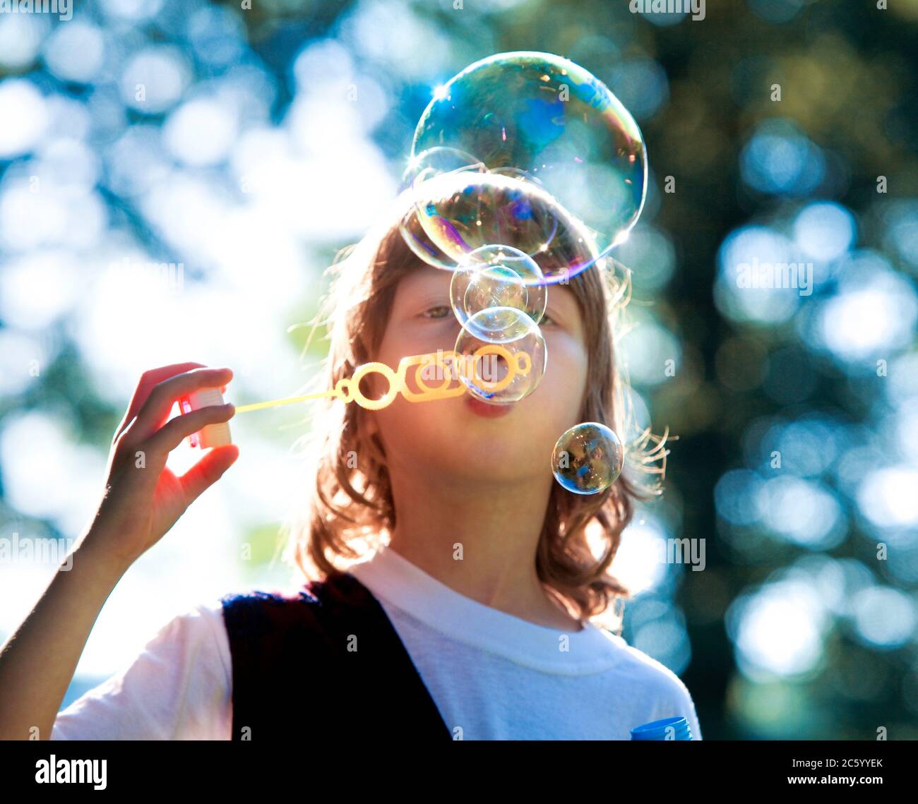 Boy Blowing Soap Bubbles Outdoor Stock Photo - Alamy Boy Blowing Soap Bubbles Outdoor Stock Photo - Alamy