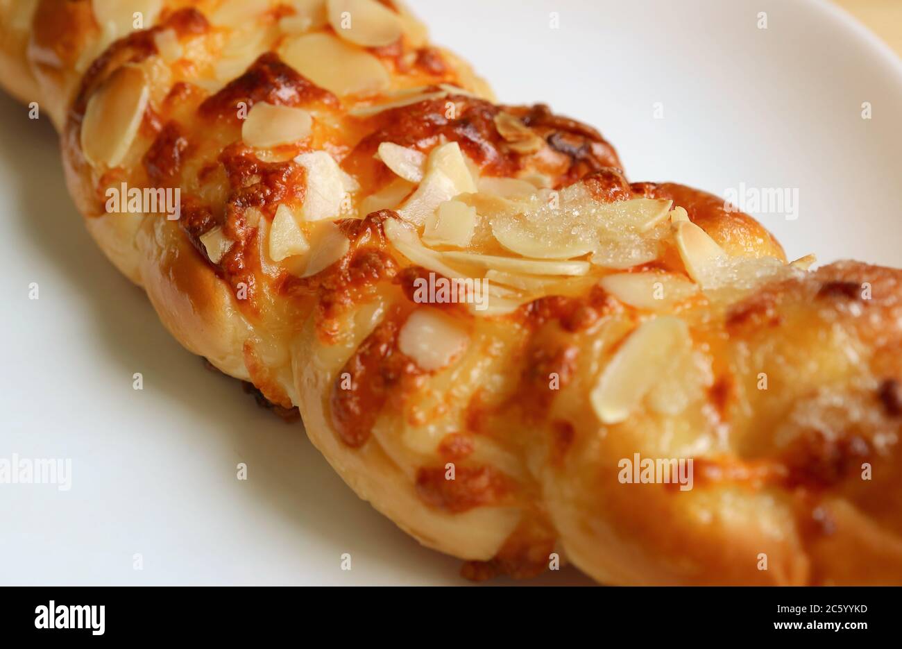 Tasty Homemade Almond Twist Bread with Sugar on a White Plate Stock ...