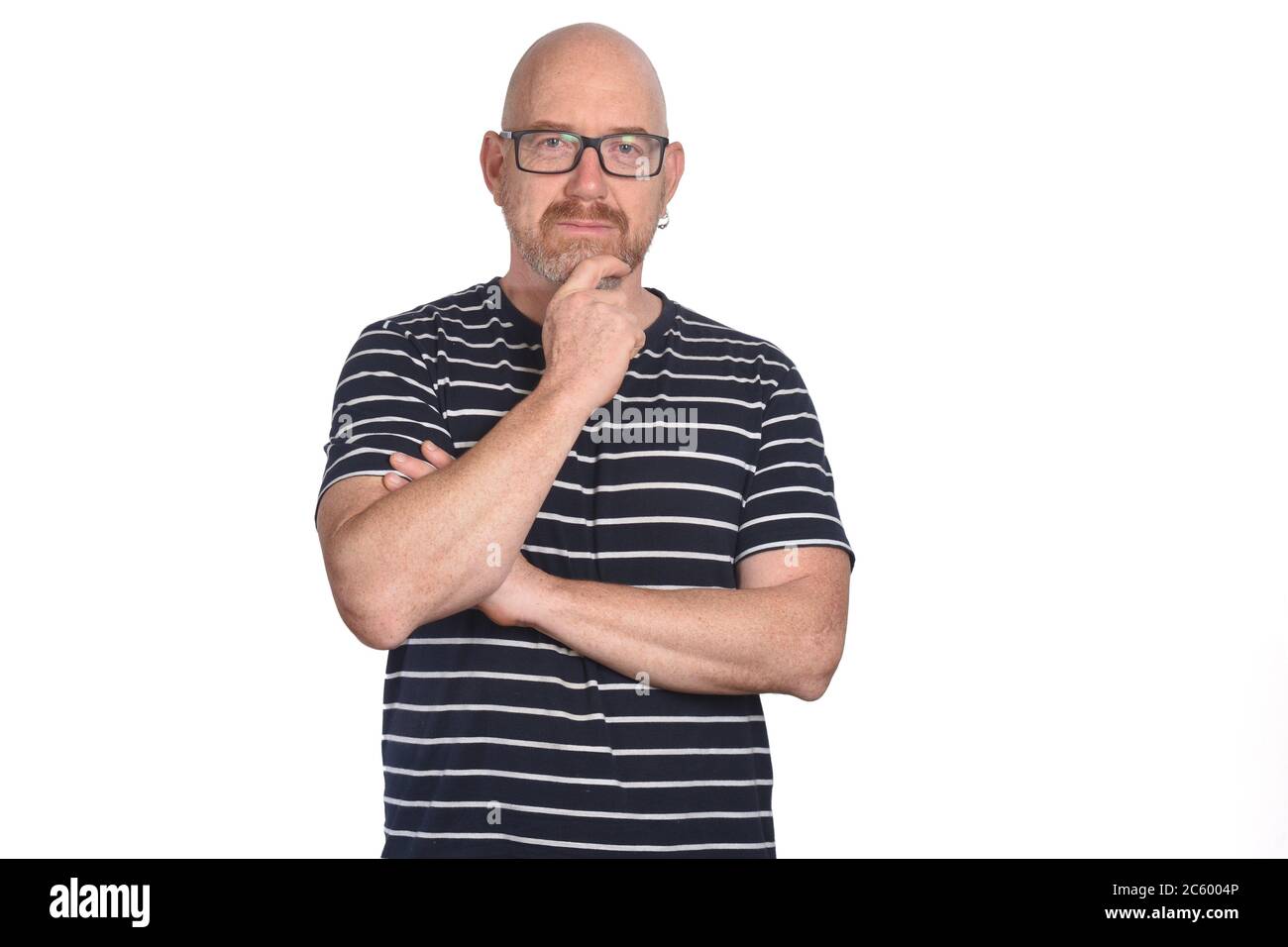 portrait of a man front view looking at camera and han on chin on white ...