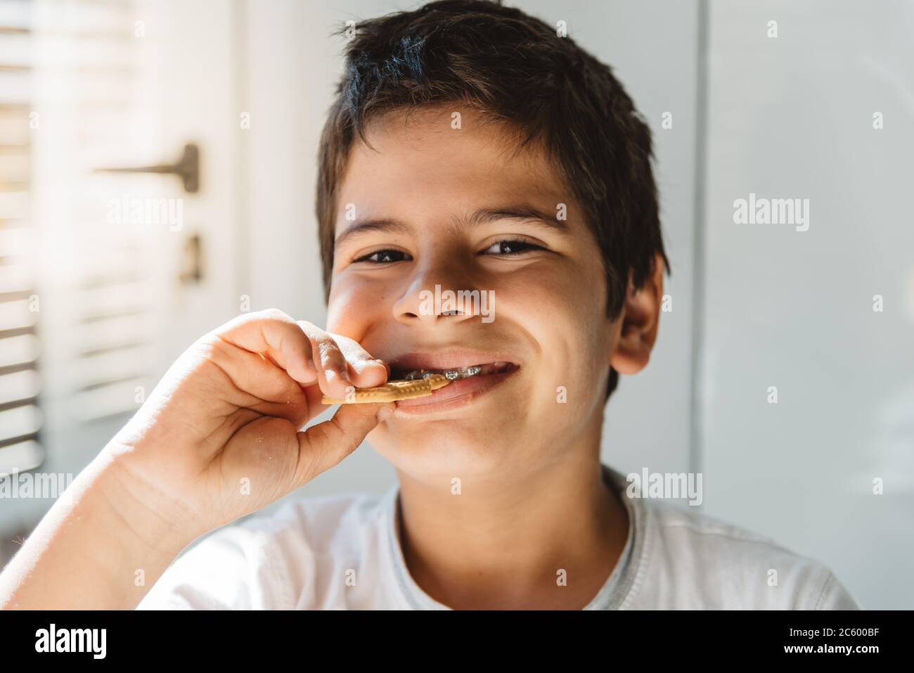Boy looking girl eating chocolate hi-res stock photography and images ...