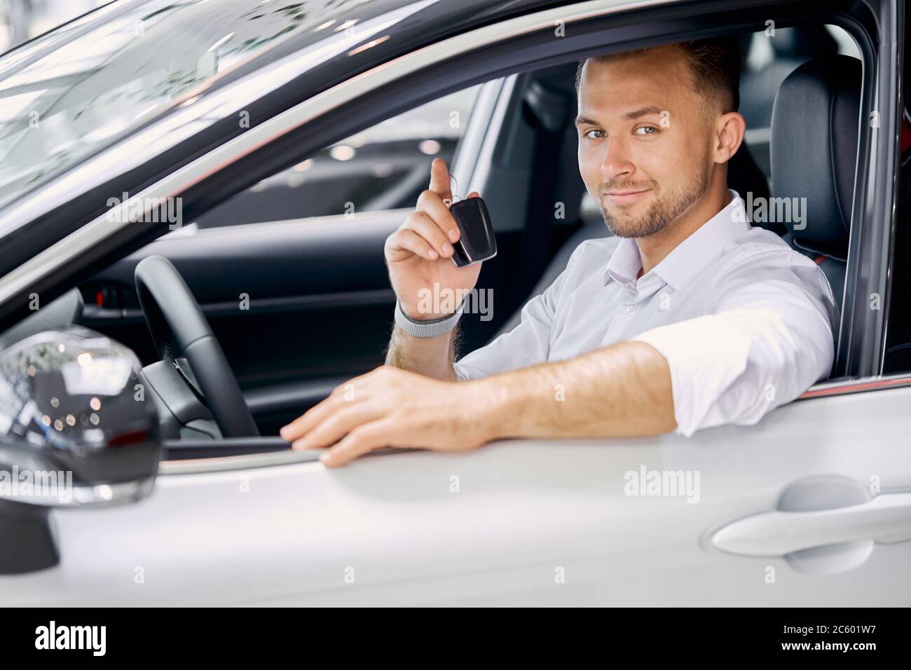 new happy car owner in dealership. man got keys of car, the perfect ...