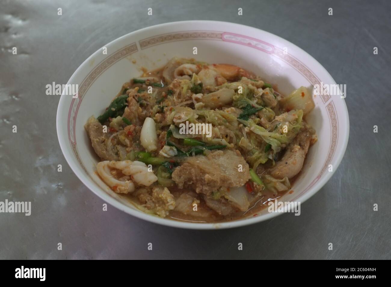 Dry Suki with pork and vegetables (Thai style) served with spicy sauce ...