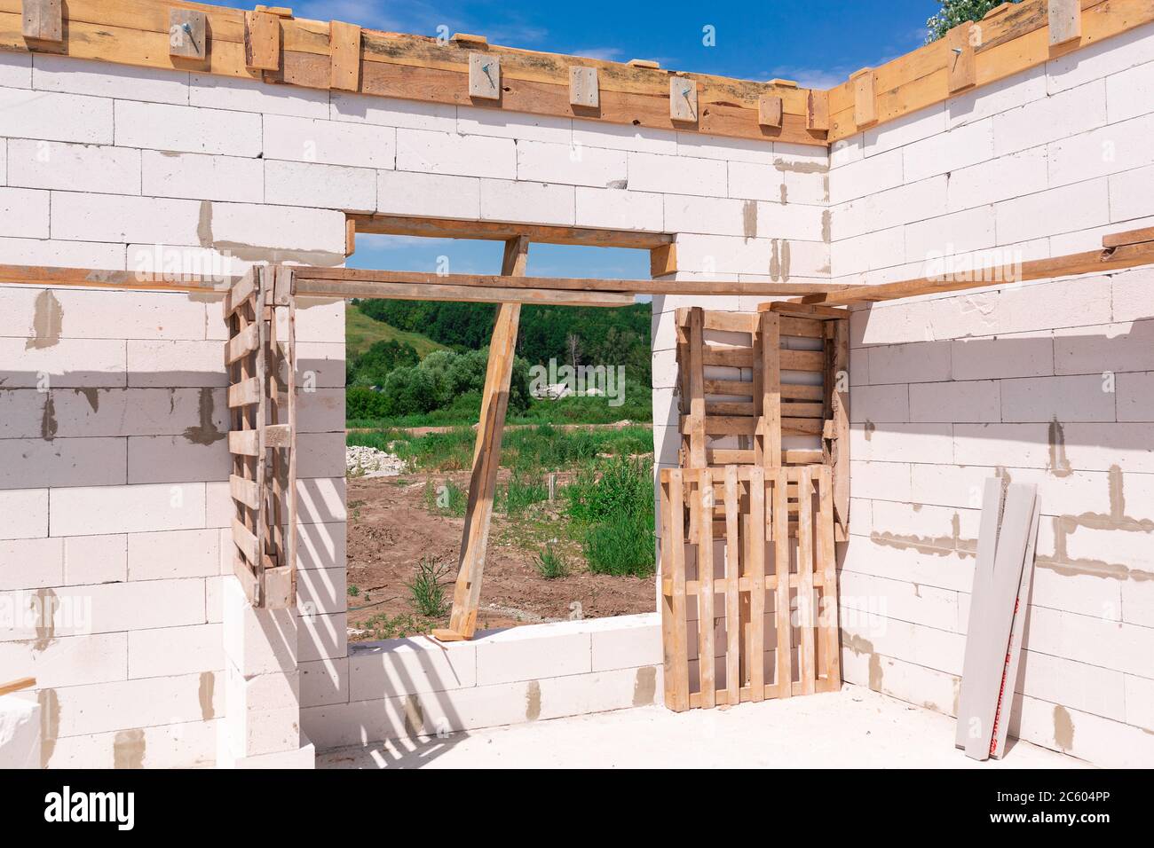 Building site of a house under construction: walls of gas concrete ...