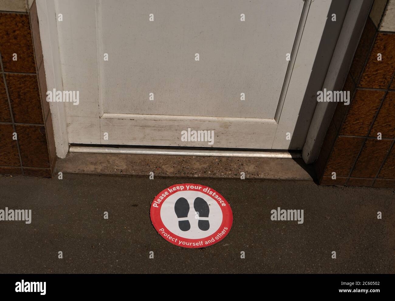 Please keep your distance sign on pavement outside shop. Covid-19 ...