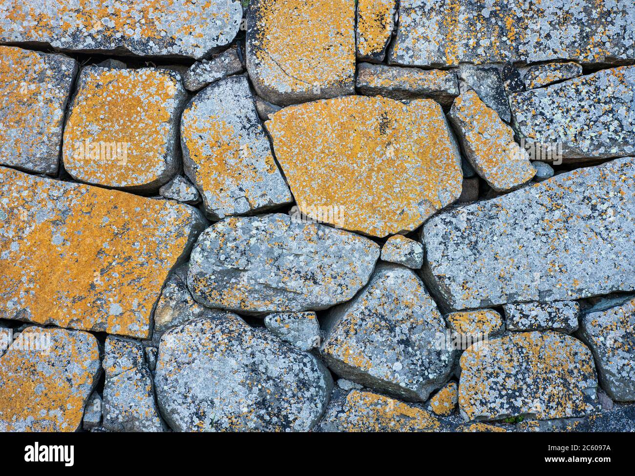Orange discoloration on ancient stone wall Stock Photo - Alamy
