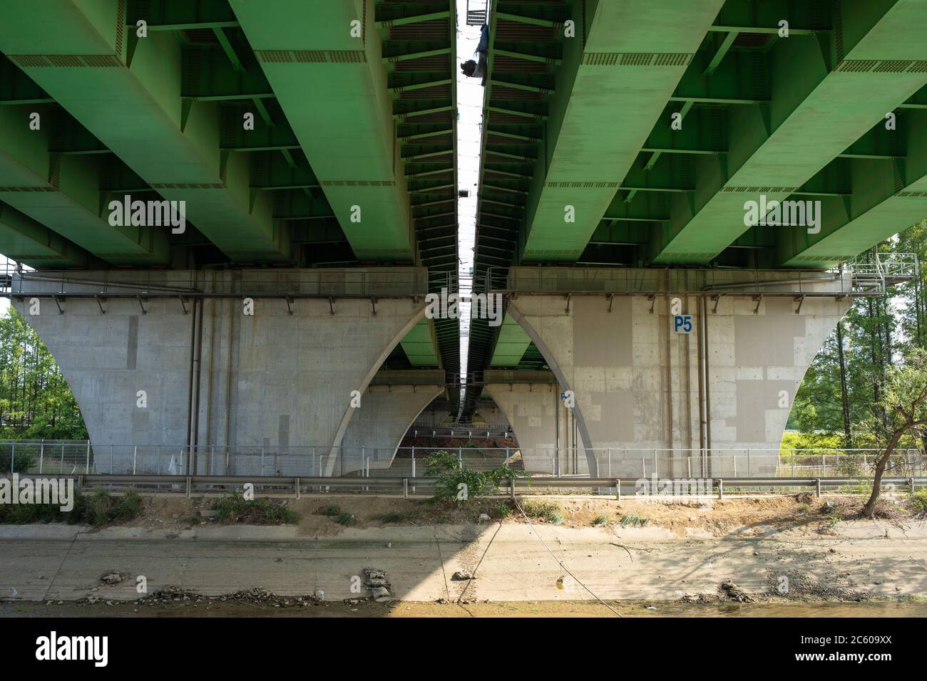 The lower surface of road piers made of steel and concrete Stock Photo ...