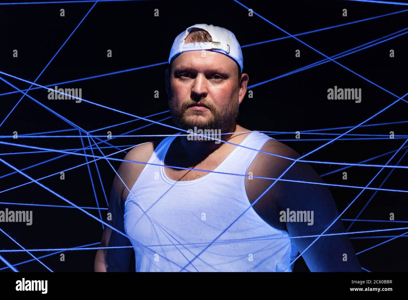 Image of stout man with white threads in ultraviolet Stock Photo - Alamy