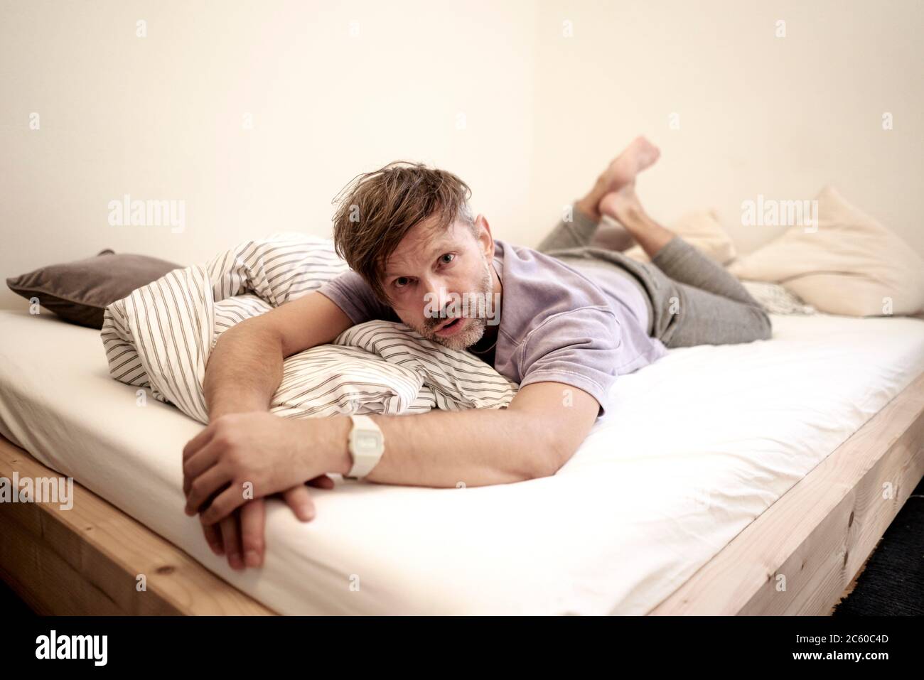 Lazy man at home Stock Photo - Alamy