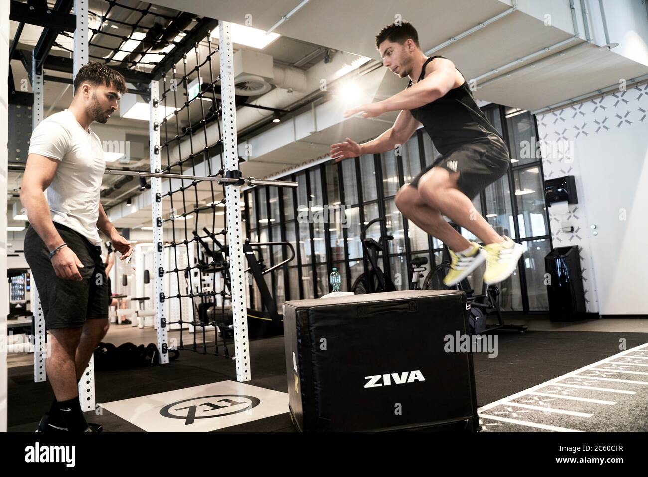 Men in gym Stock Photo - Alamy
