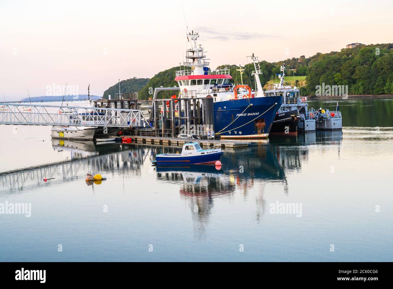 Vessels moored at St Georges Pier in the Menai Strait, which separates ...