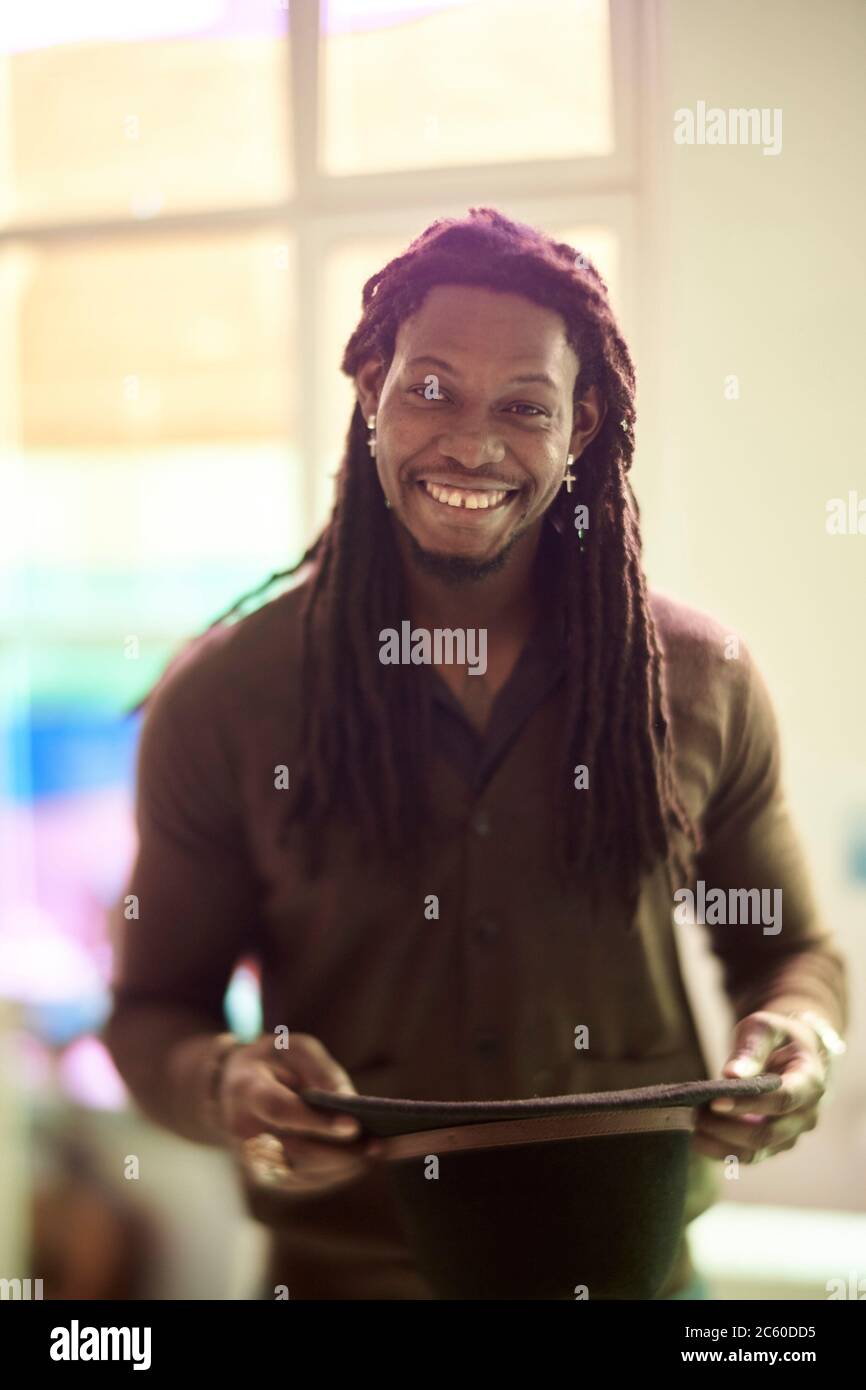 happy Afro-American man with empty hat in hands Stock Photo - Alamy