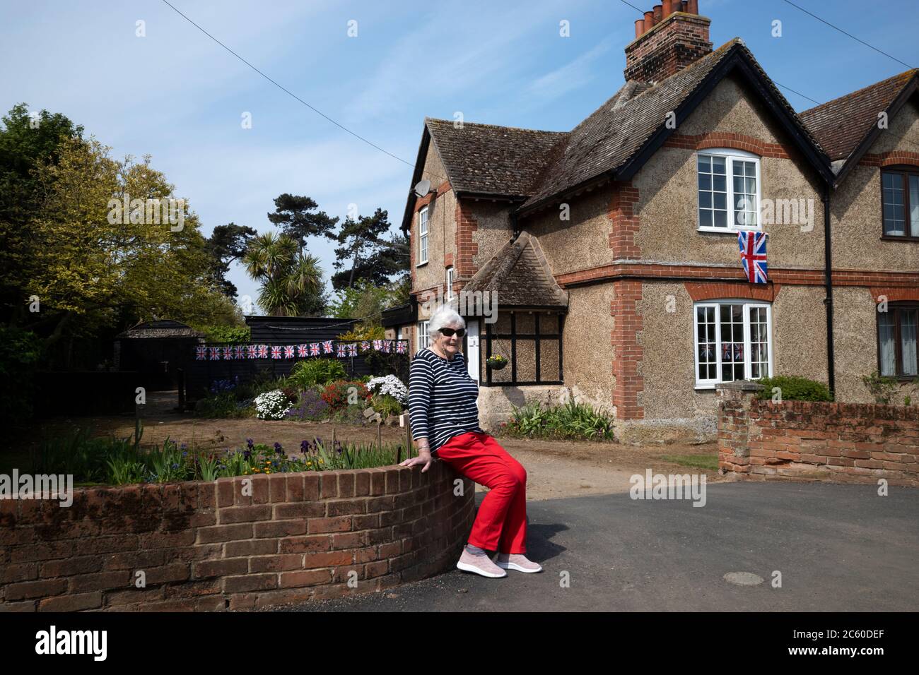 Elderly village woman outside house hi-res stock photography and images ...