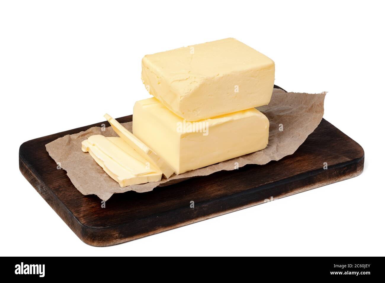 Butter on wooden board isolated on white background Stock Photo - Alamy