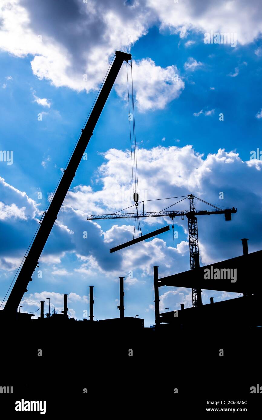 Crane hoisting material hi-res stock photography and images - Alamy