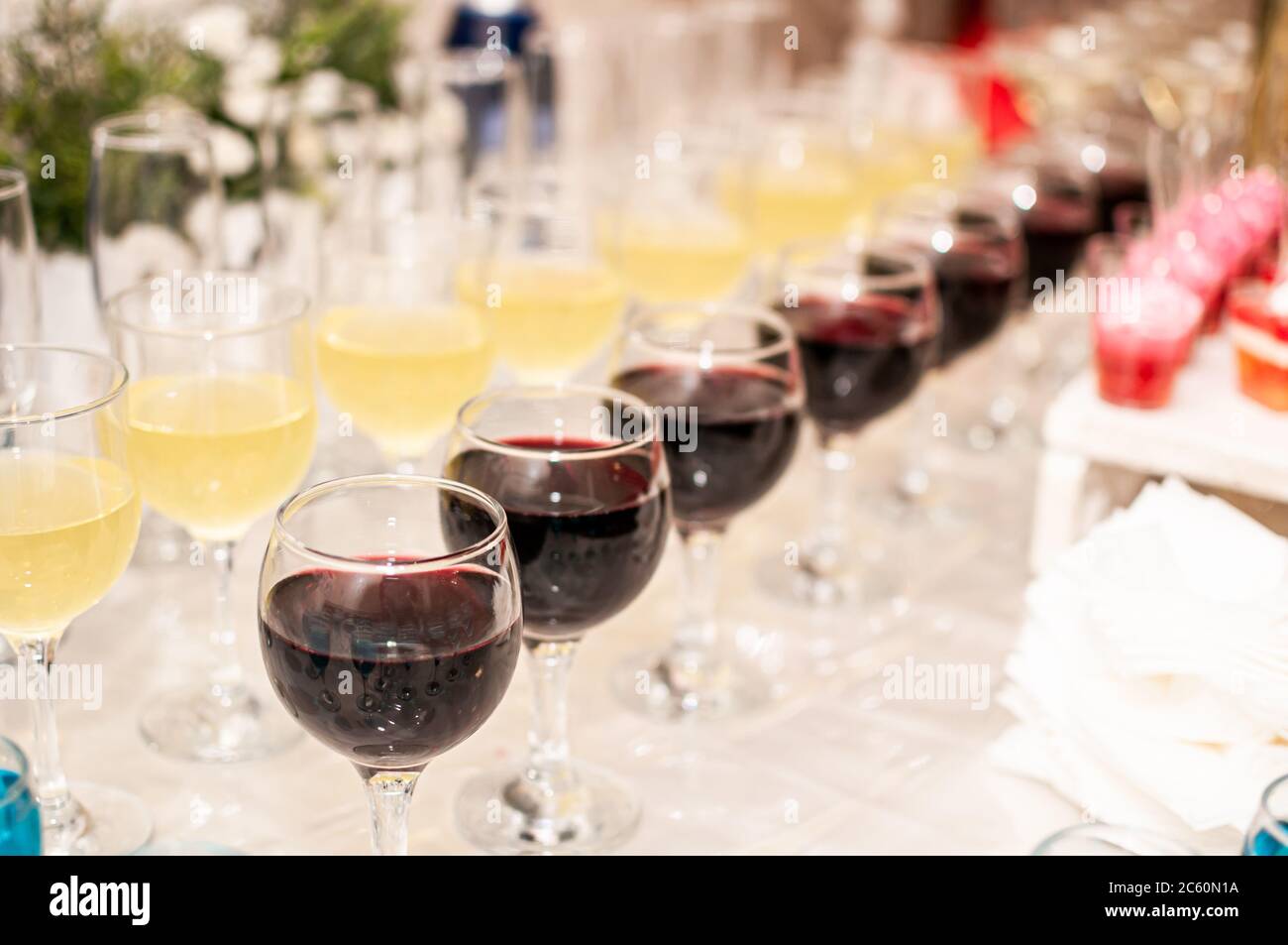 Wedding buffet. Red wine and yellow cocktail Stock Photo - Alamy