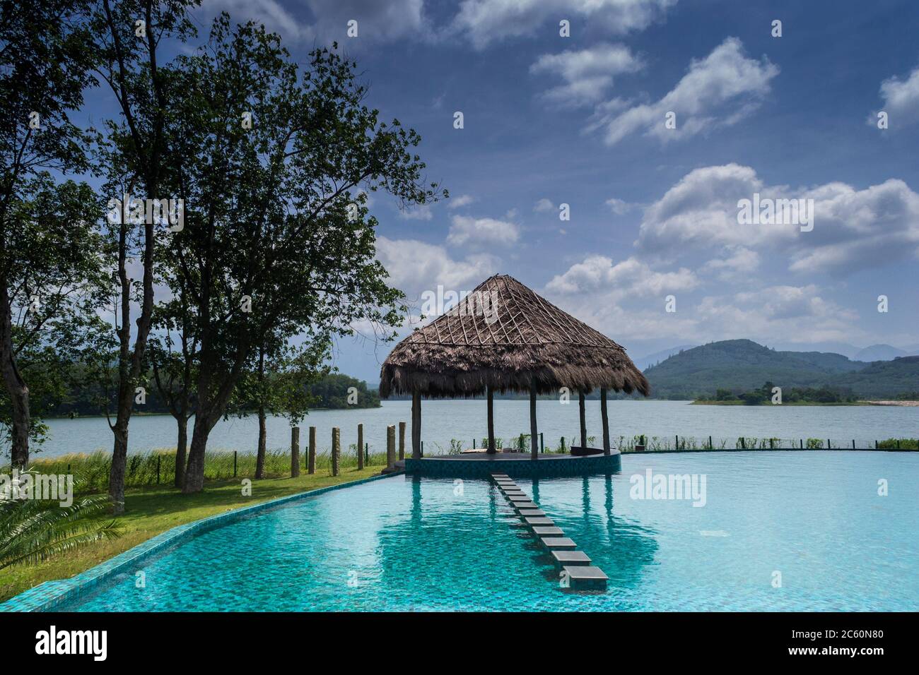 a small shade made with straw with lake facing swimming pool Stock ...