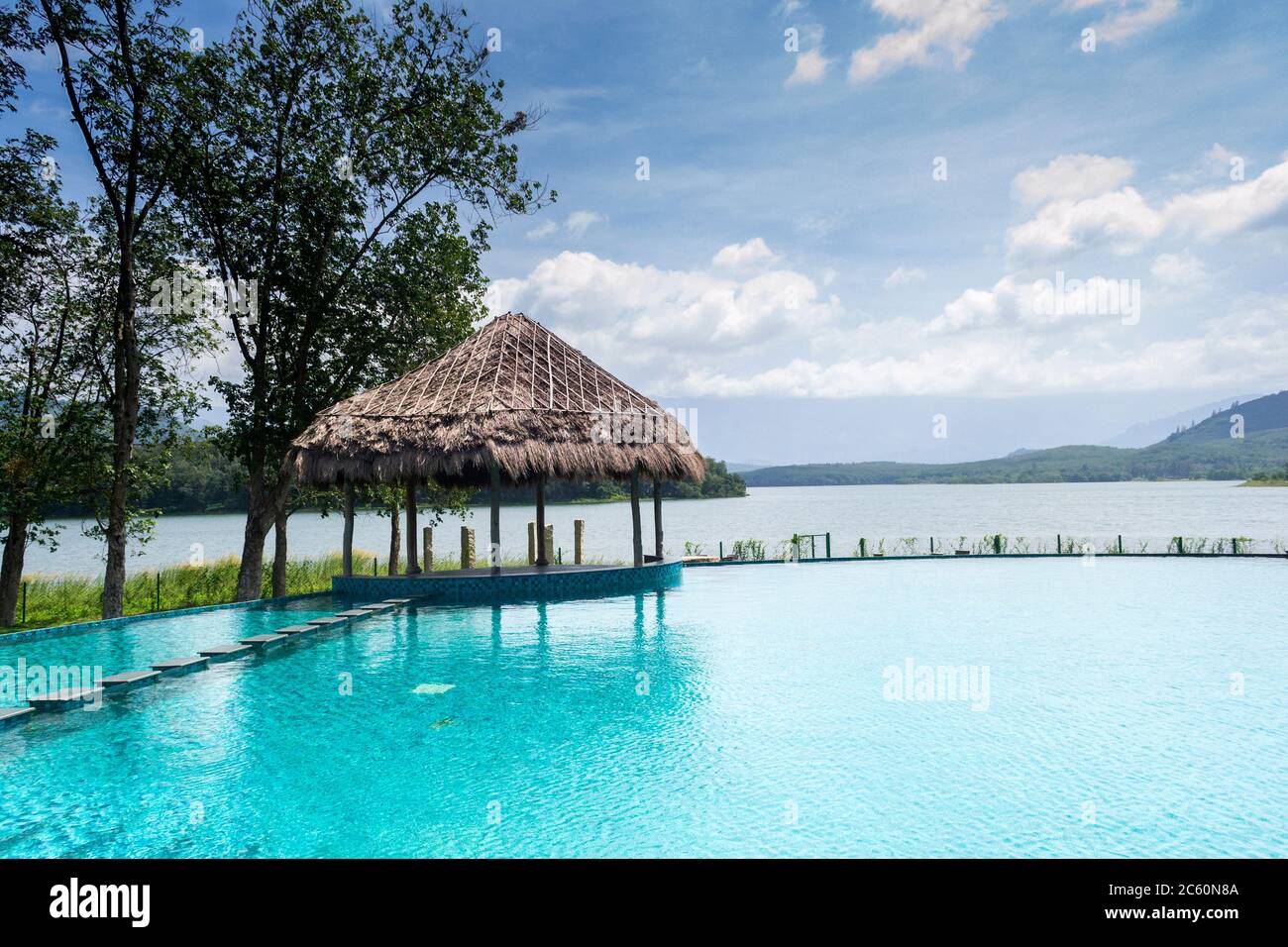 a small shade made with straw with lake facing swimming pool Stock ...