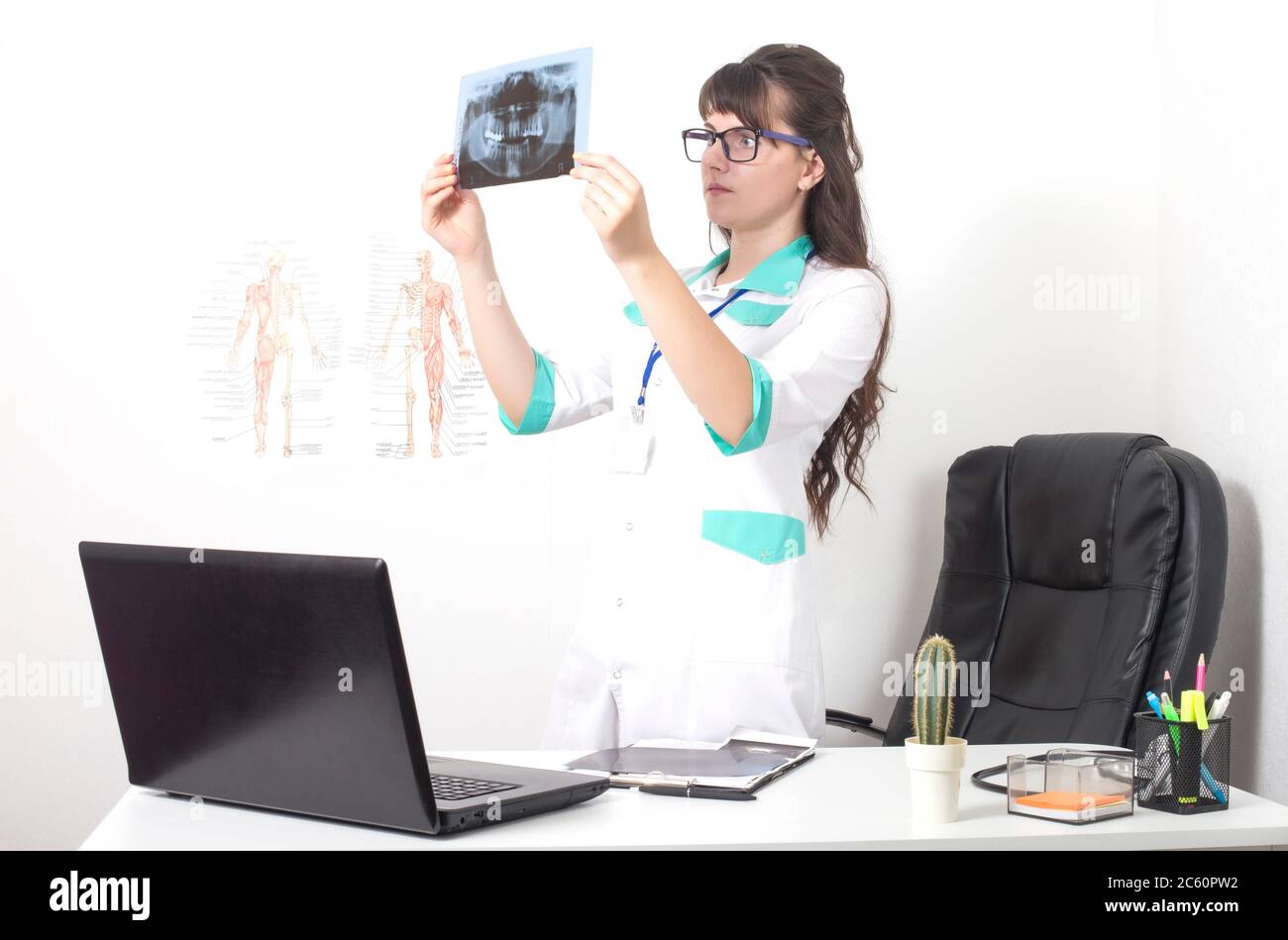 Dentist doctor watching x-ray picture of jaw and teeth. Dentures ...