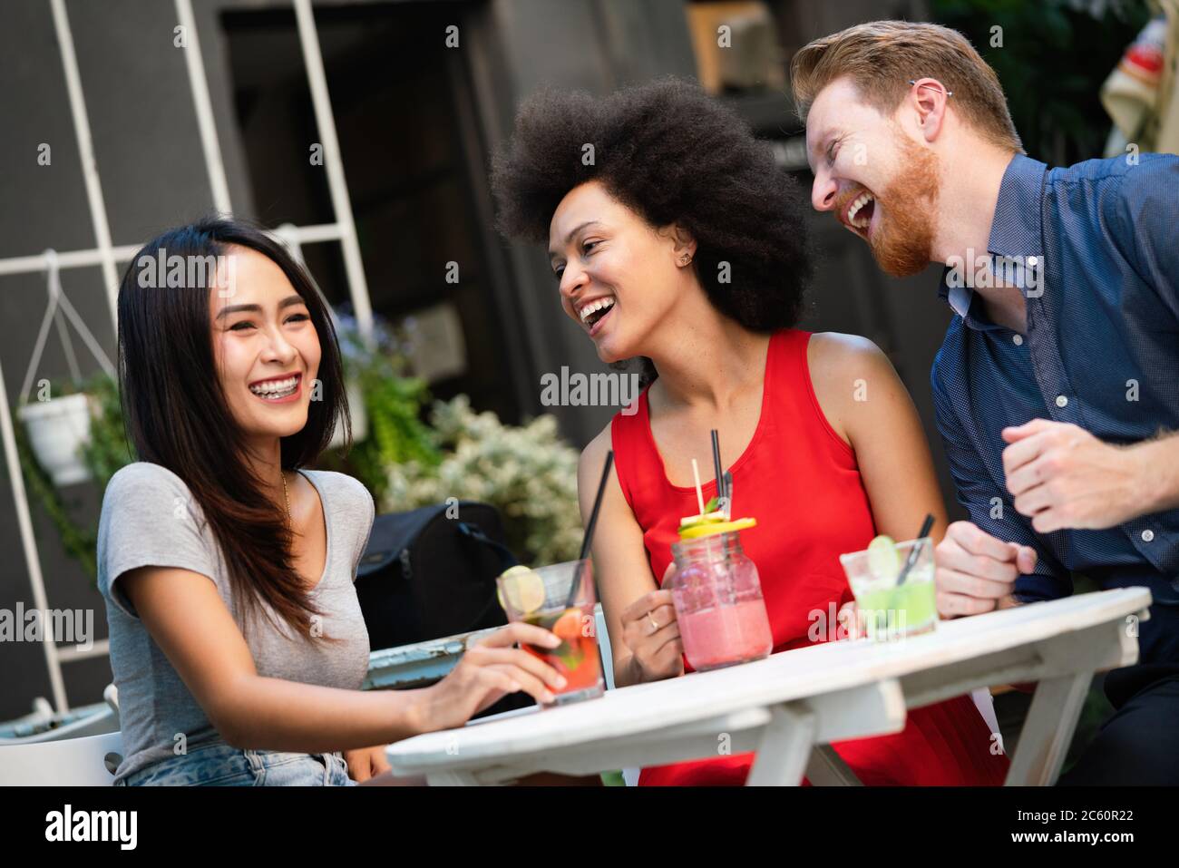 Group of friends having fun together. People talking laughing and ...