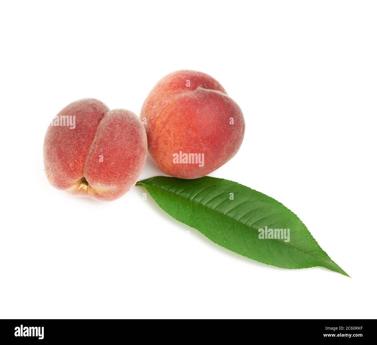 ripe red peach and green leaf, sweet fruit isolated on a white ...