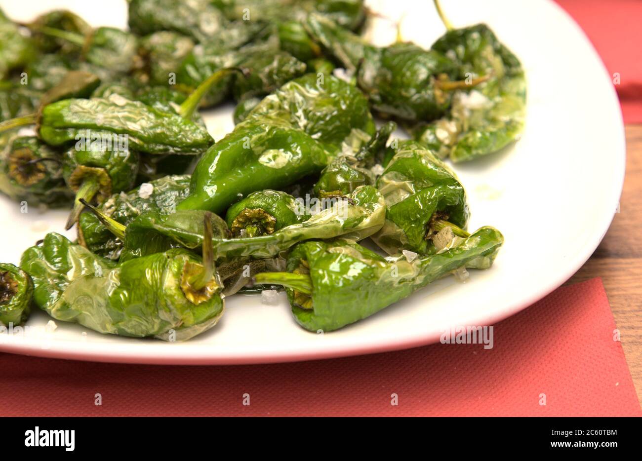 Classic Spanish tapa - fried small green peppers with sea salt Stock ...