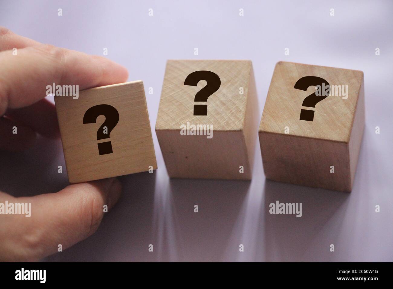 Questions Marks on wooden cubes. FAQ Communication and Brainstorming ...