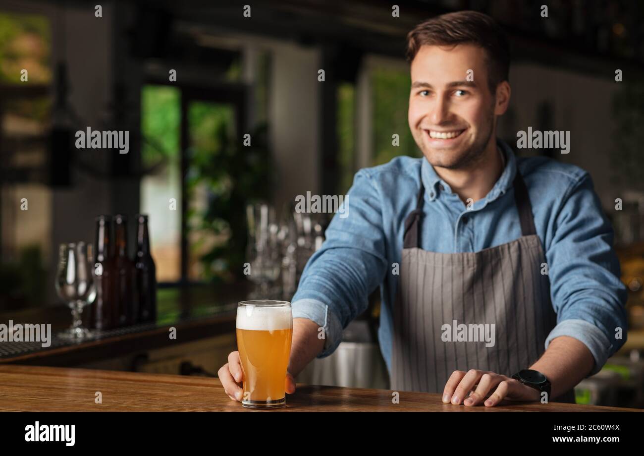 Bartender puts glass draft beer hi-res stock photography and images - Alamy