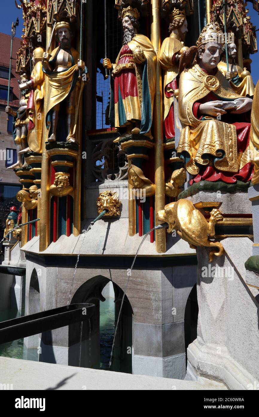 Nuremberg landmark in Germany. Beautiful Fountain (Schoener Brunnen) at ...