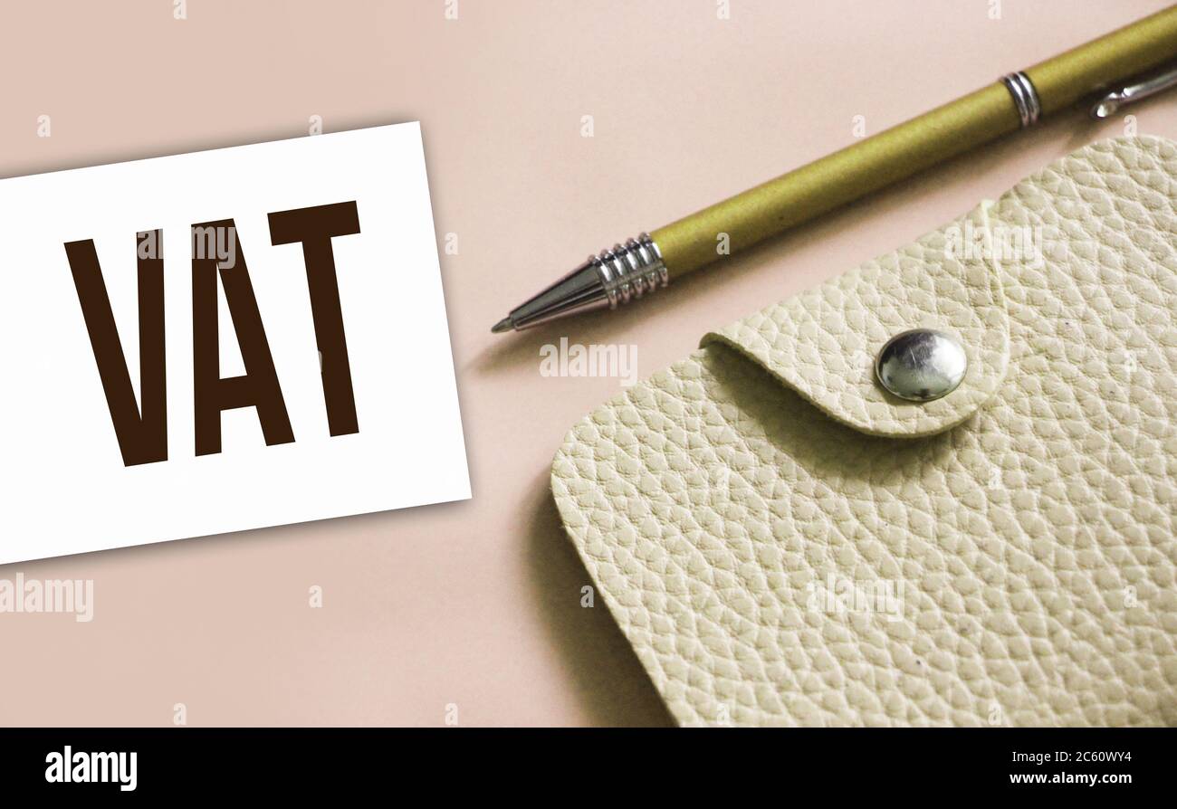 VAT on business card, pen and leather wallet. Value added tax financial ...