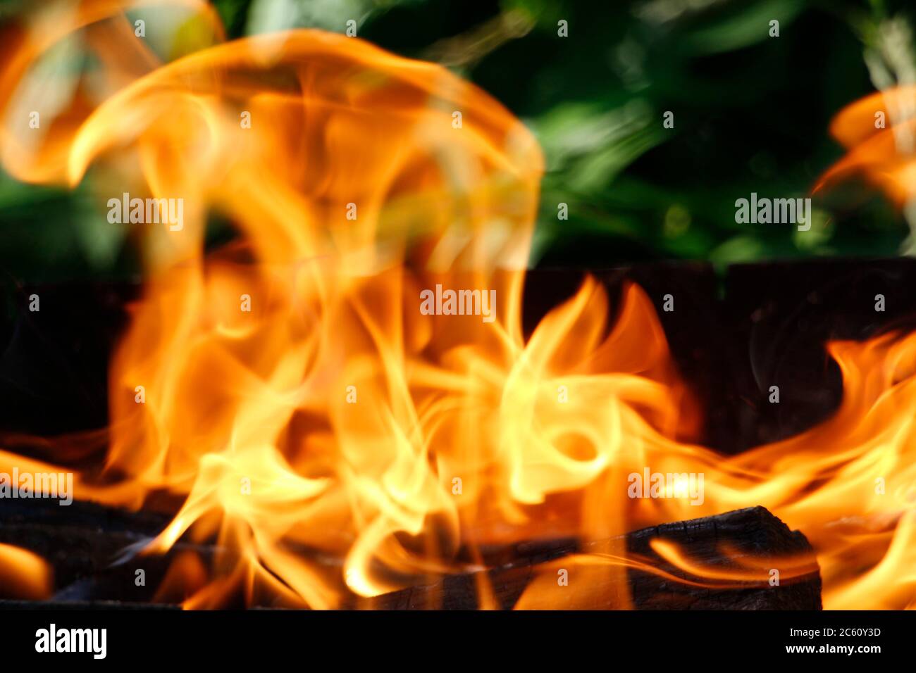 Bonfire. Orange flame of a fire. Bonfire on the grill with smoke. Arson ...