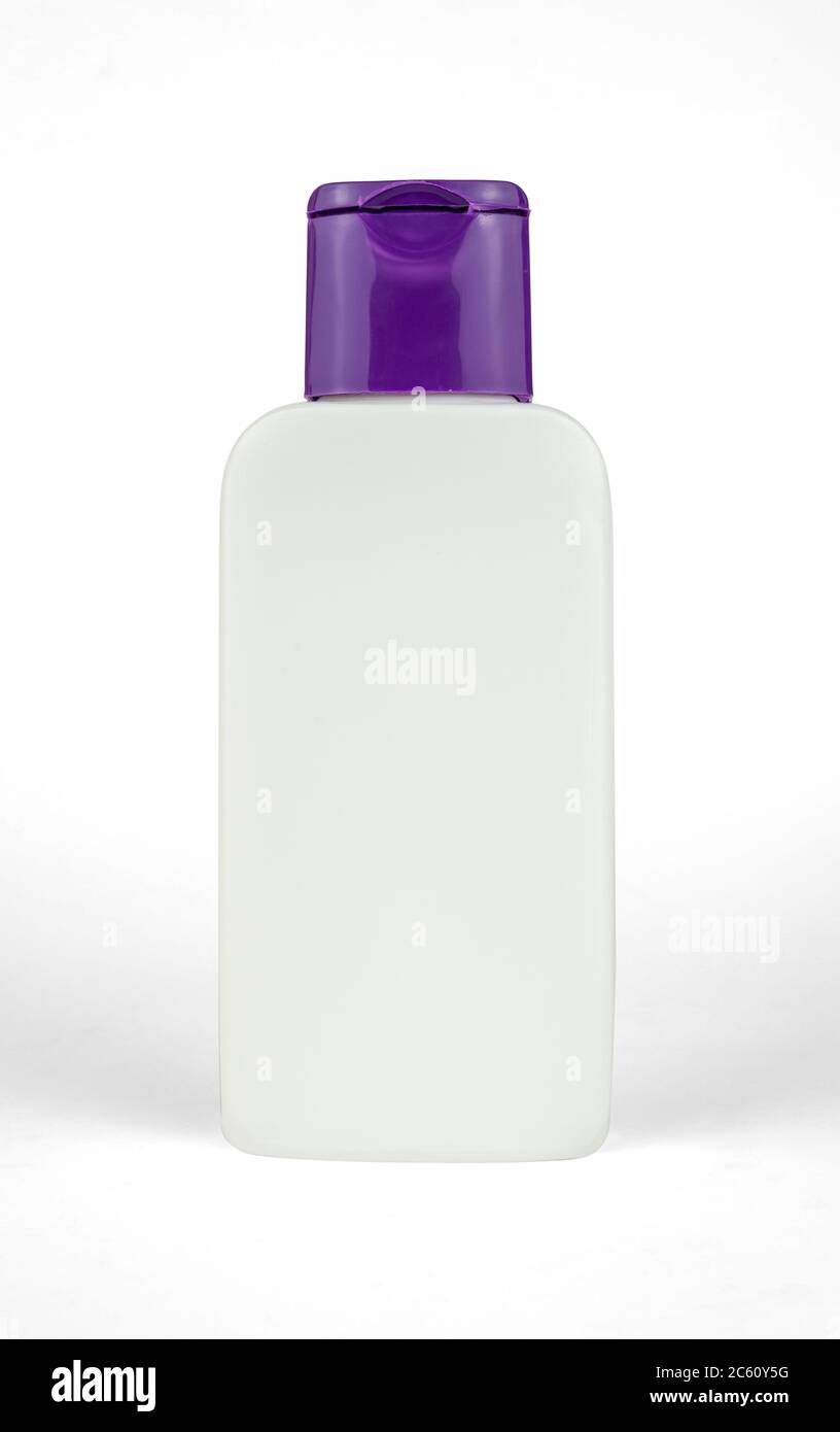White plastic bottle with violet color lid isolated on white background ...