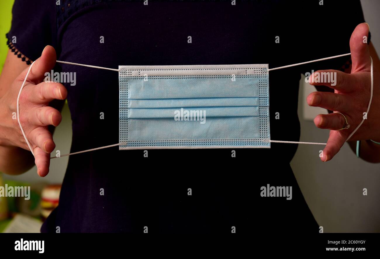 Attaching a mask probably hi-res stock photography and images - Alamy