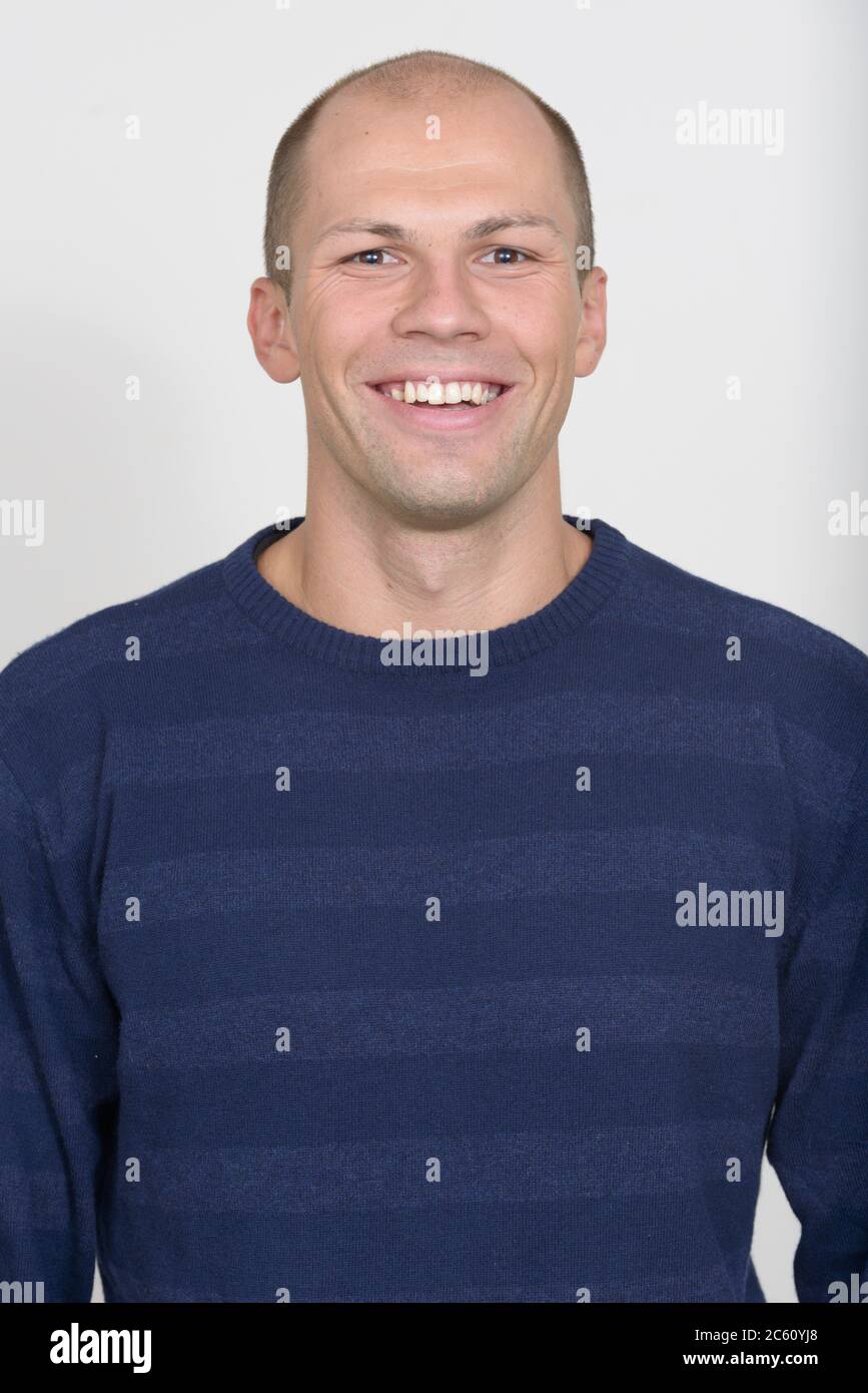 Portrait of happy young handsome bald man smiling Stock Photo - Alamy