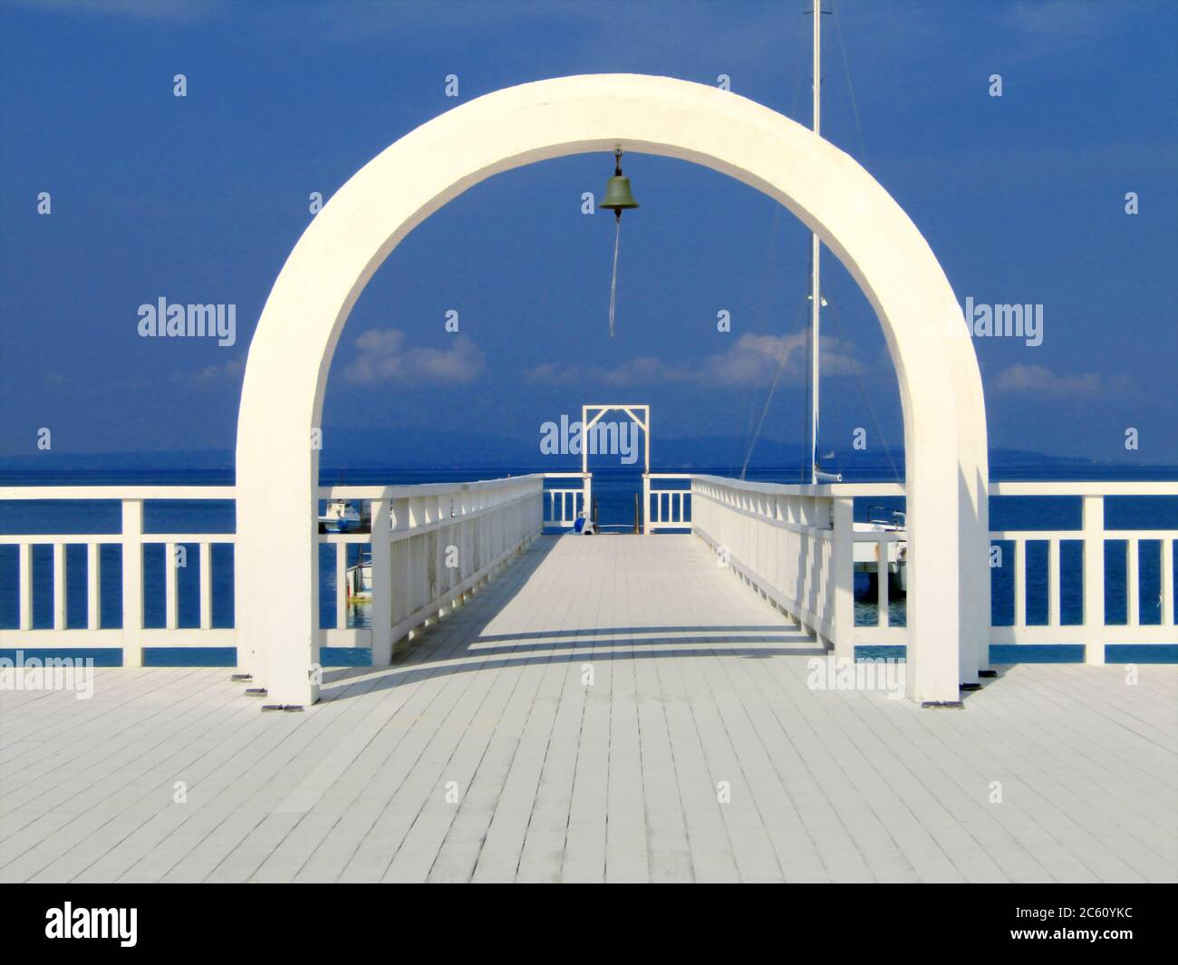 White arch gate ,blue sky ,sea ,pier Stock Photo - Alamy