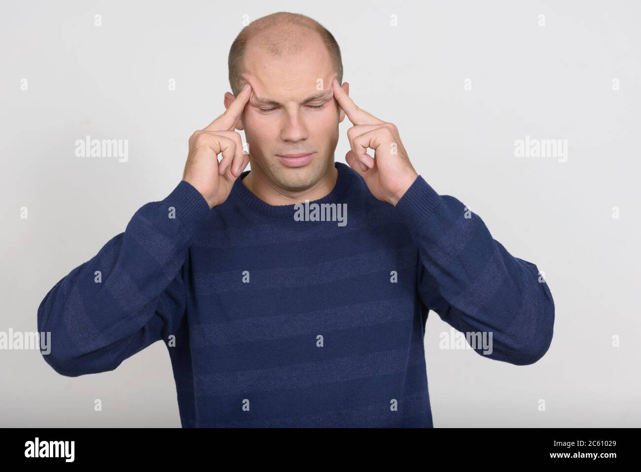Portrait of stressed young bald man having headache Stock Photo - Alamy