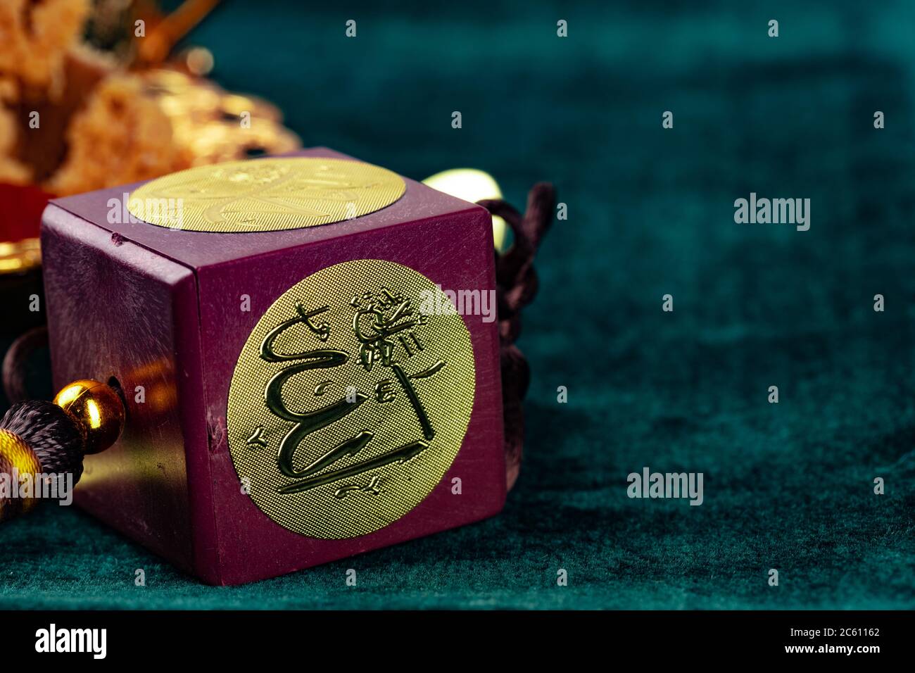 Muslim amulet of bordeux color on rope Stock Photo - Alamy