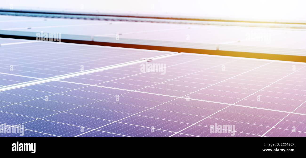 Solar panels on house roof at sunset against blue sky. Solar energy ...