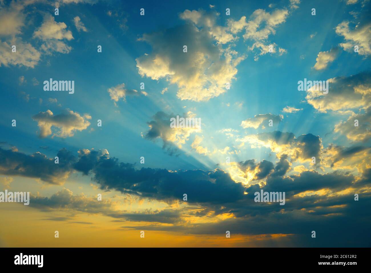 Epic sky landscape with bright sun behind dark fantastically beautiful ...