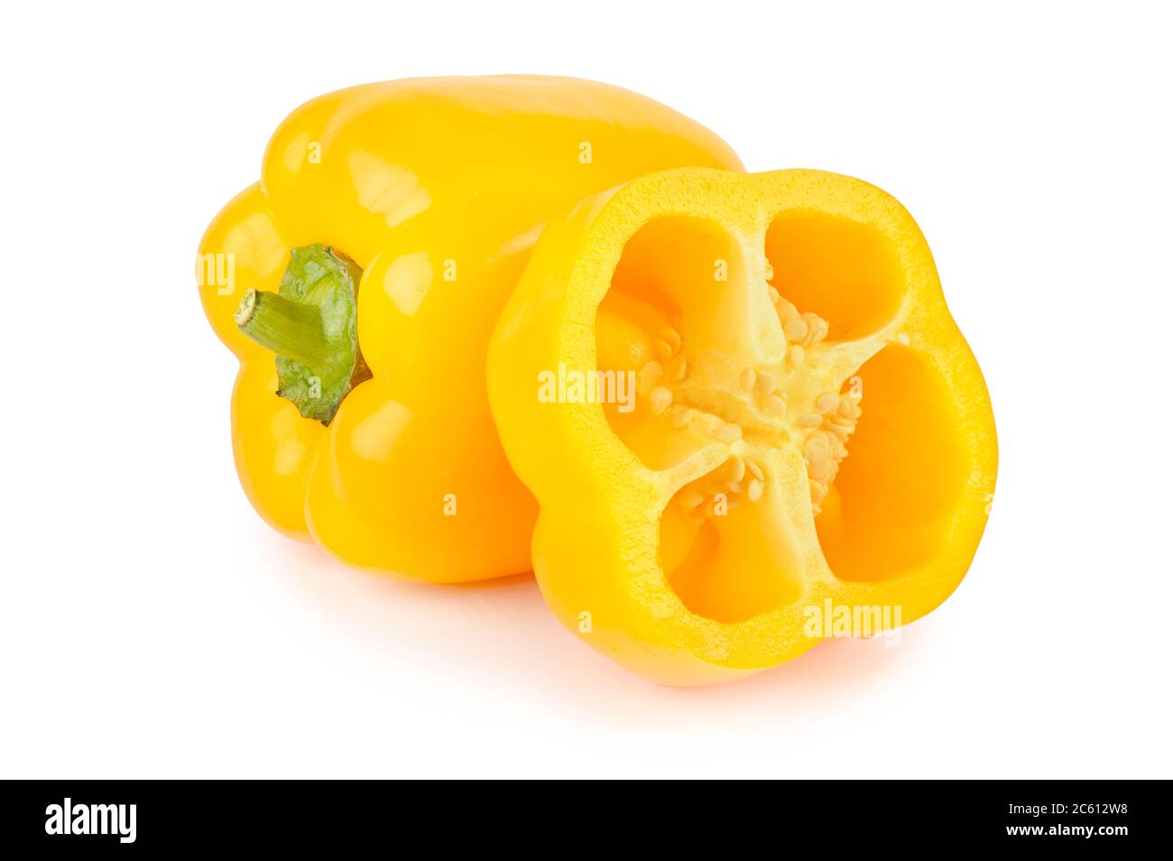 Whole yellow bell peppers and half isolated on white background Stock ...