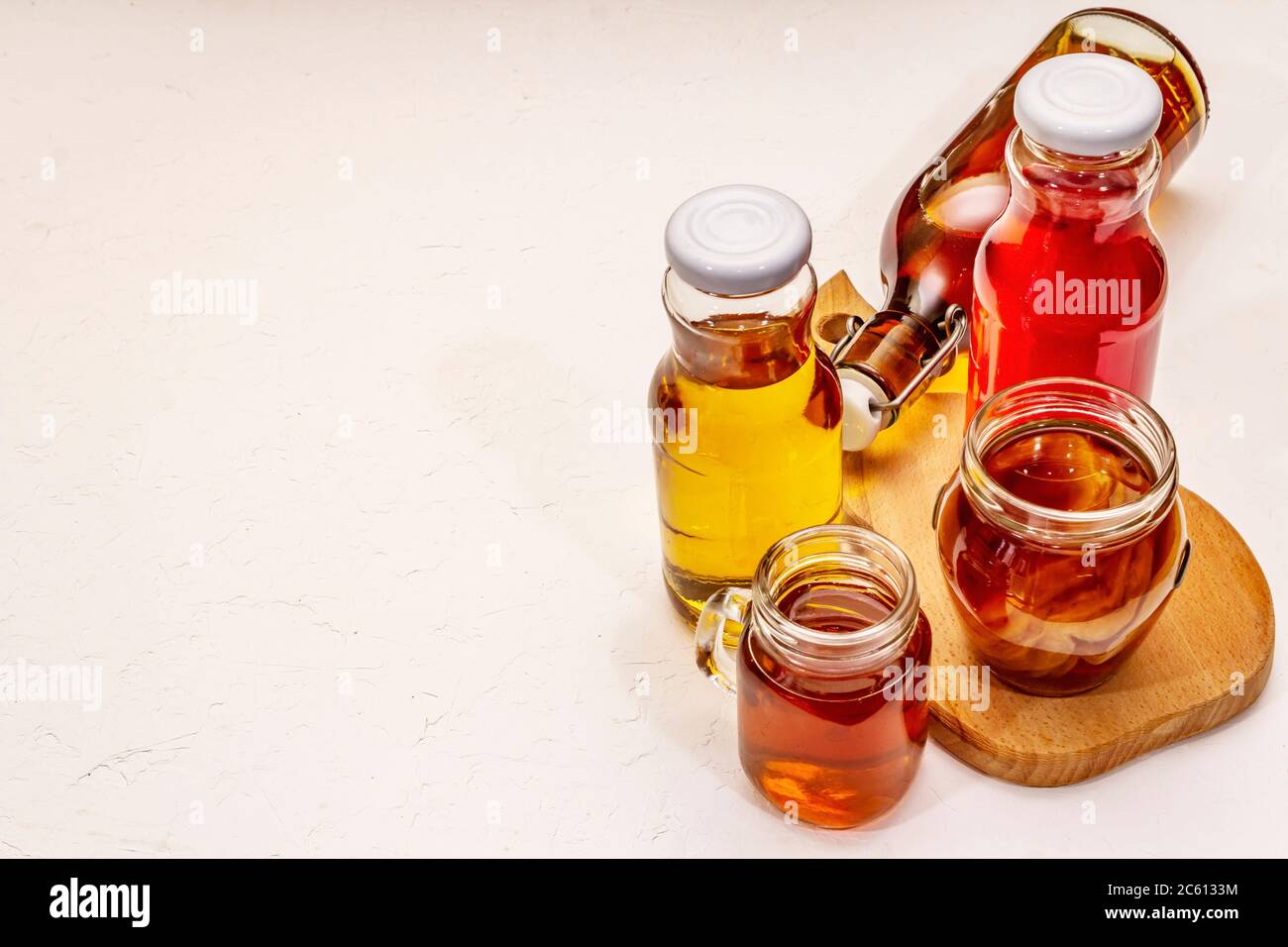 Kombucha in glass bottles. Set of different flavors. Healthy fermented ...