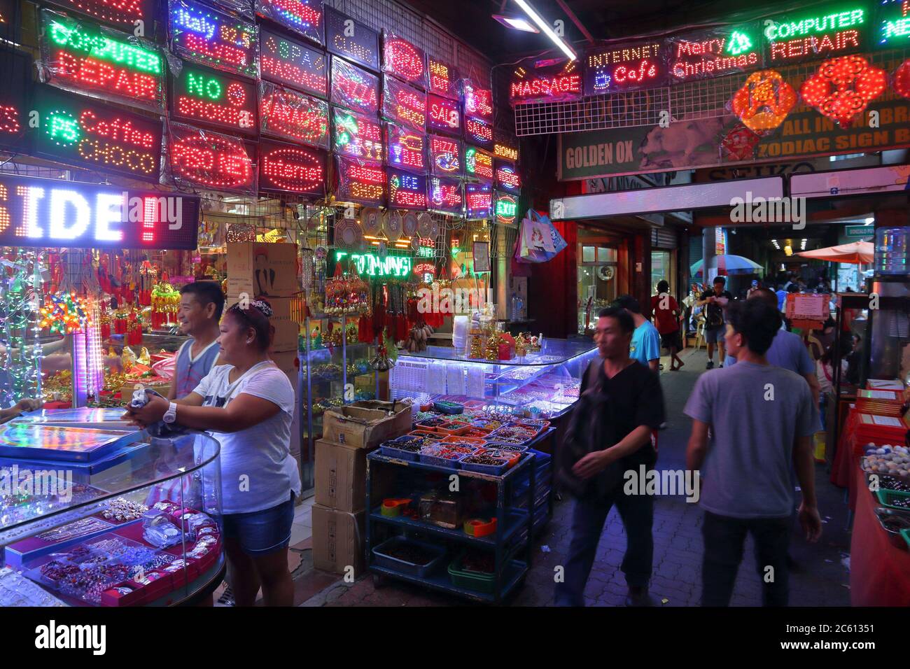 MANILA, PHILIPPINES - NOVEMBER 25, 2017: People visit a neon store ...