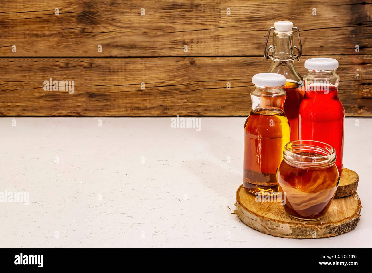 Kombucha in glass bottles. Set of different flavors. Healthy fermented ...