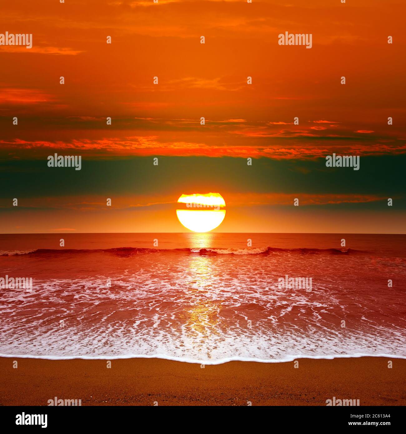 Epic sunset over ocean, sea waves and sand Stock Photo - Alamy