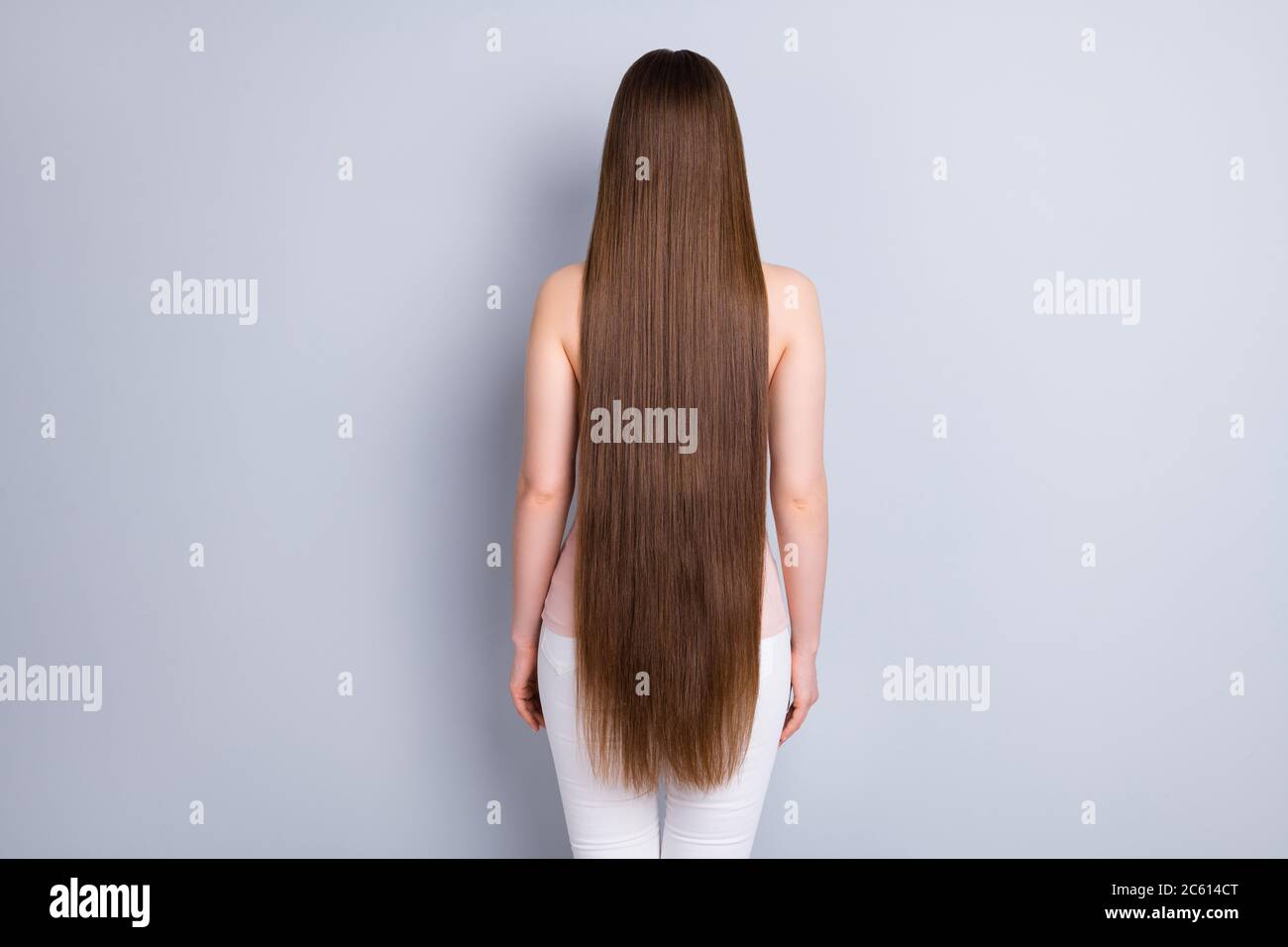 Rear back behind view photo of perfect model lady demonstrating ideal ...