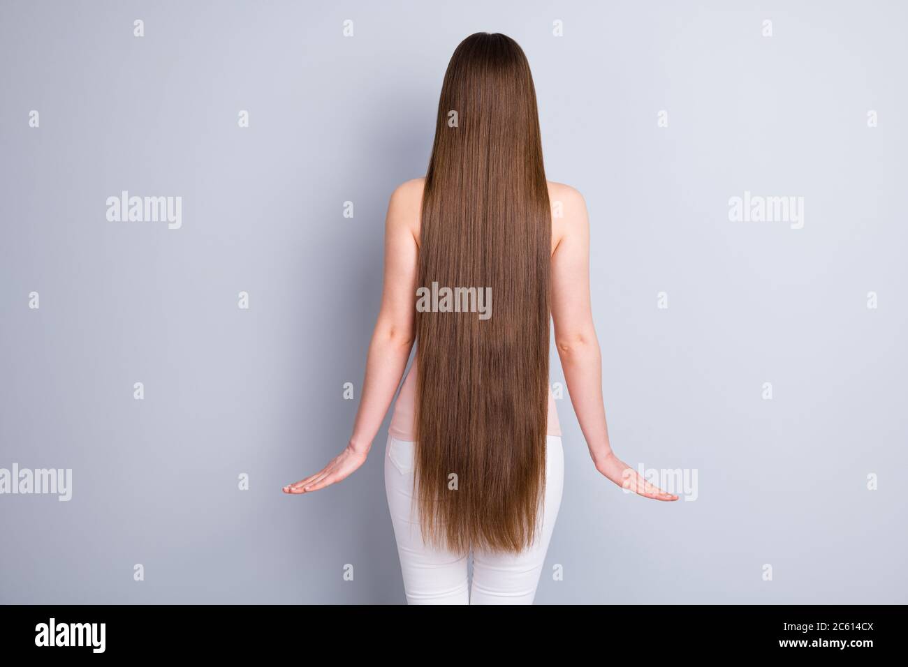 Rear back behind view photo of perfect model lady demonstrating ideal ...